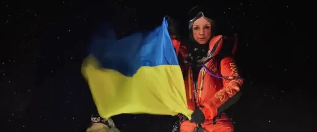 Russian Katya Lipka holds the Ukrainian flag on Mt. Everest
